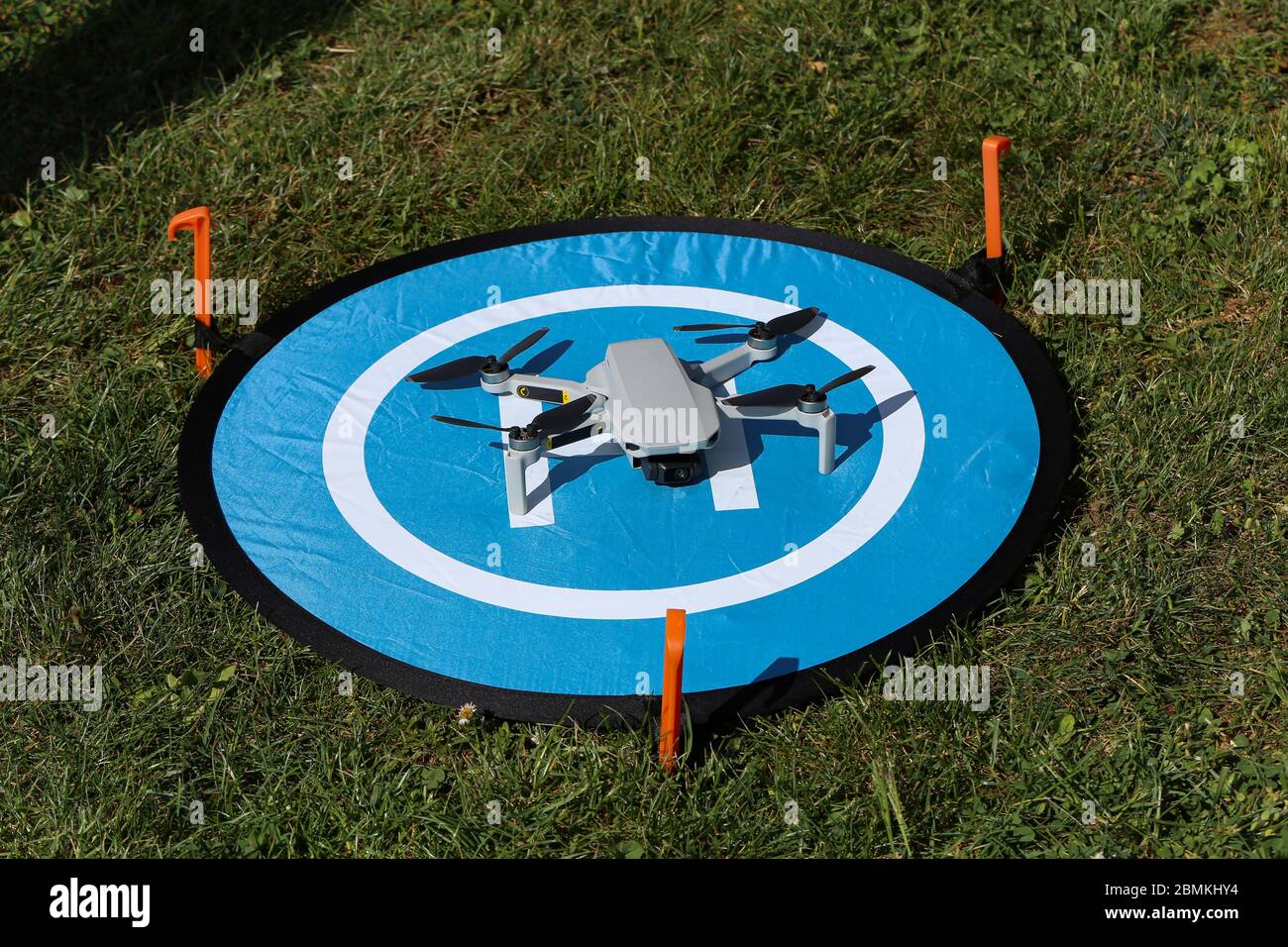 Drone stands on a take-off and landing pad Stock Photo - Alamy