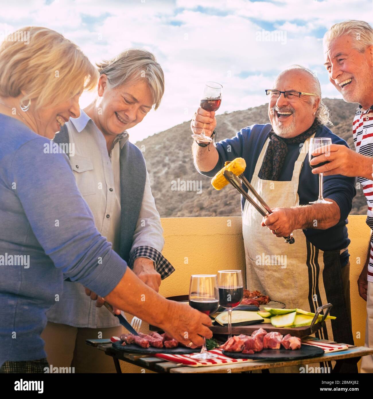 Group elderly friends celebrating after hi-res stock photography and ...
