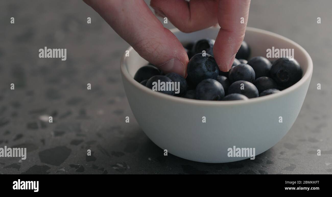 Man hand take berry hi-res stock photography and images - Alamy