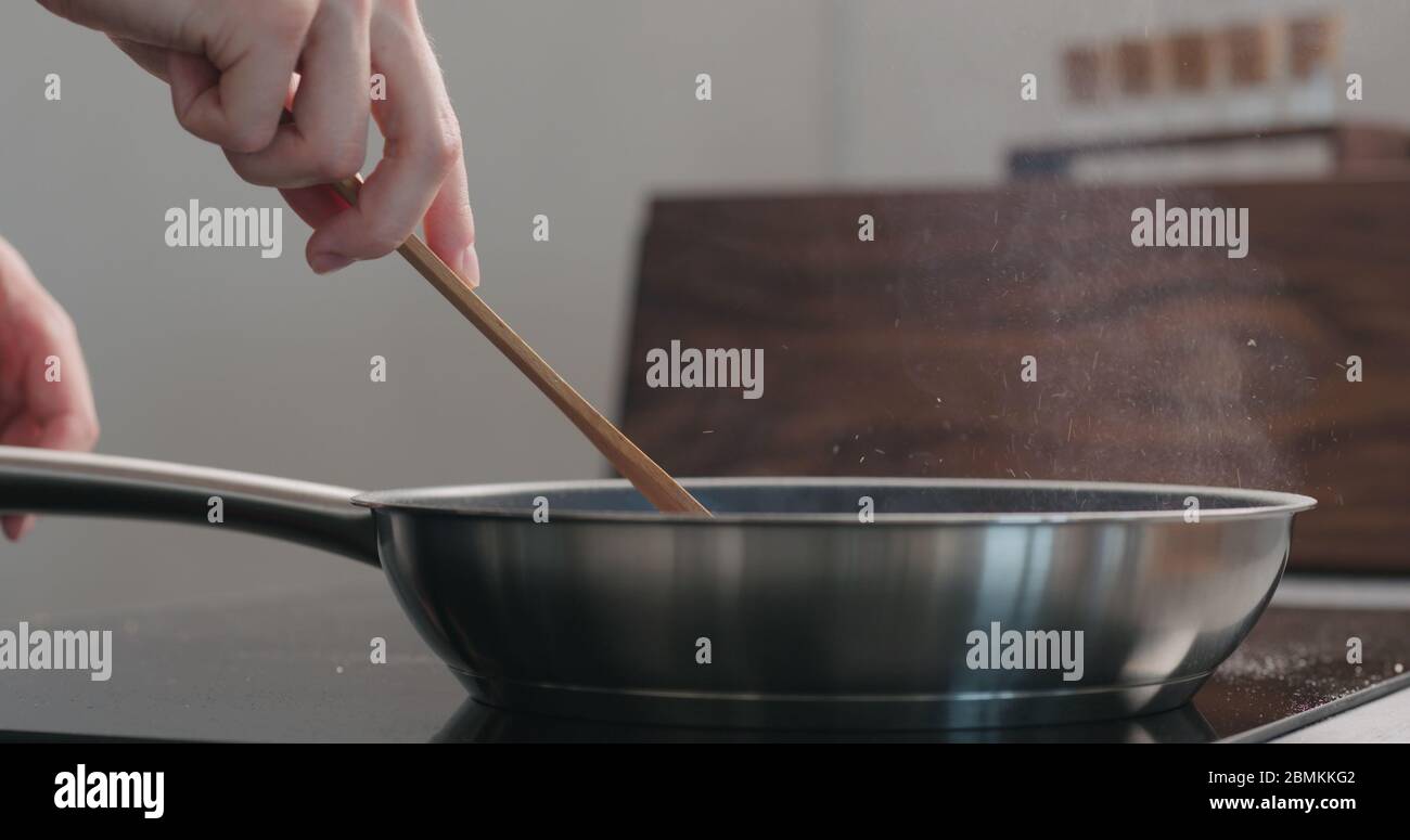 Induction cooking male hi-res stock photography and images - Alamy