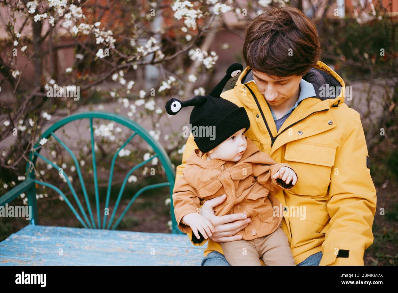 Father and son walk through the city on the street Stock Photo - Alamy
