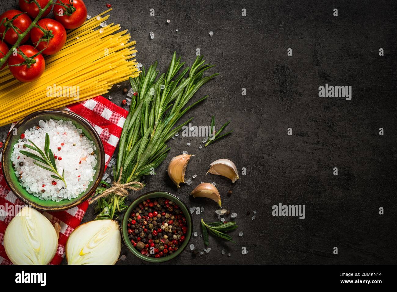 Food cooking background on black kitchen table Stock Photo - Alamy