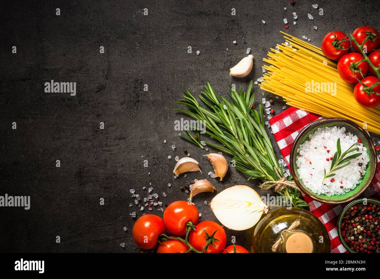 Food cooking background on black kitchen table Stock Photo - Alamy