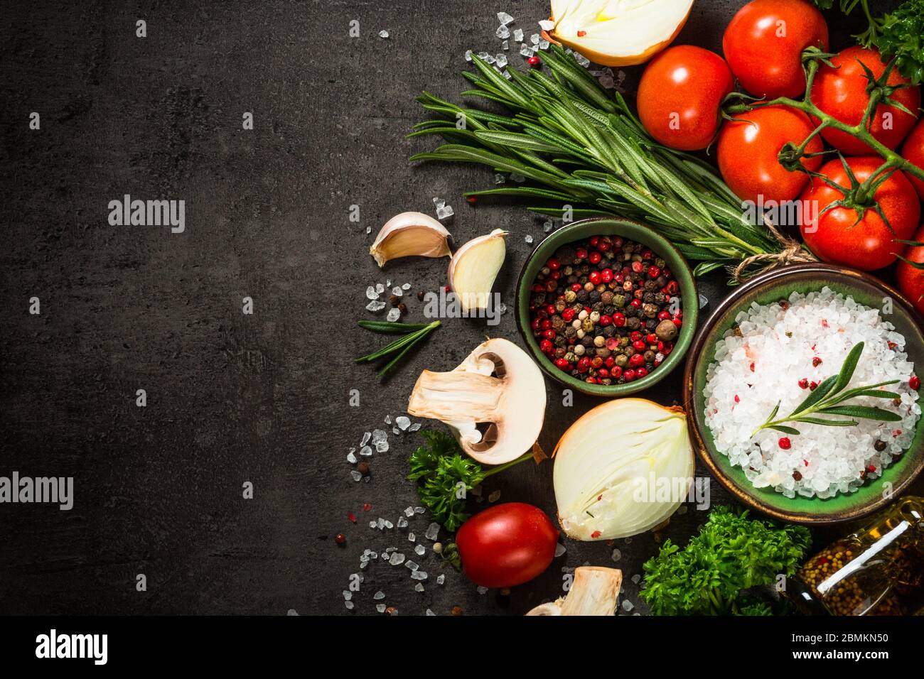 Food cooking background on black kitchen table Stock Photo - Alamy