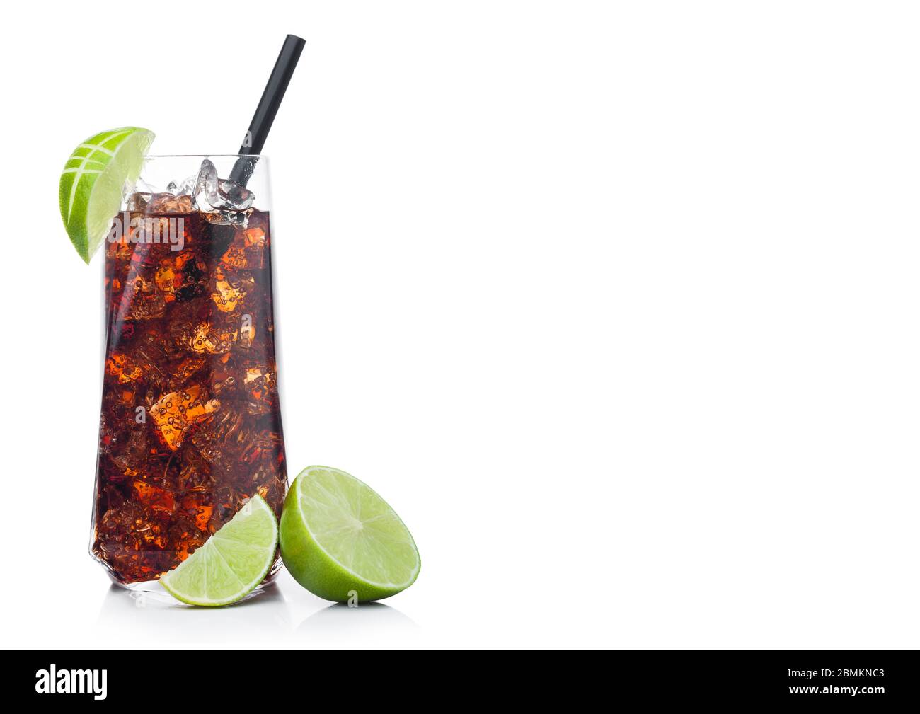 Cuba Libre Cocktail in luxury tall glass with ice cubes and slices of ...