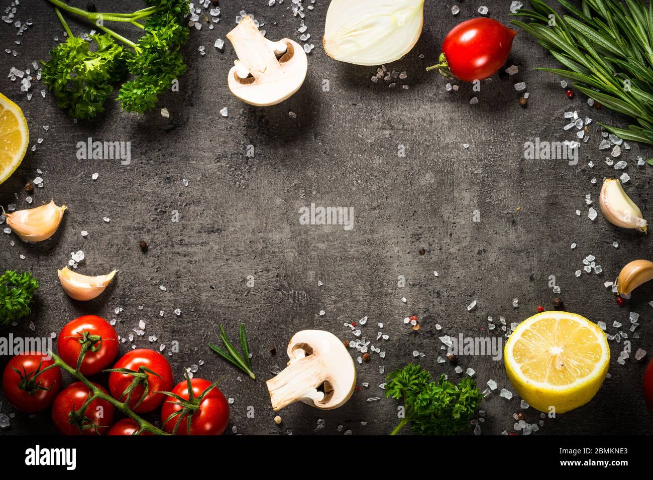 Food cooking background on black kitchen table Stock Photo - Alamy