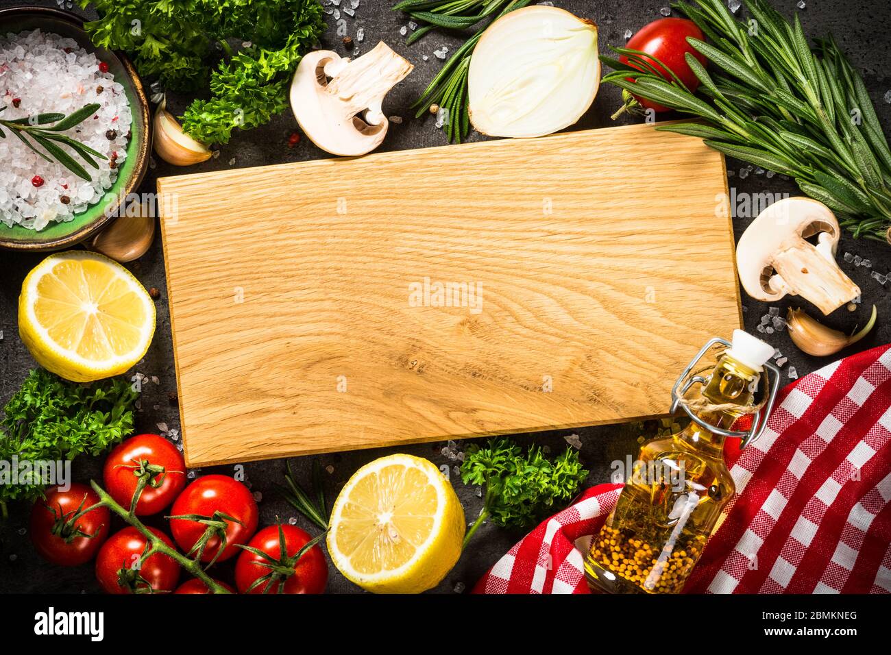 Food cooking background on black kitchen table Stock Photo - Alamy