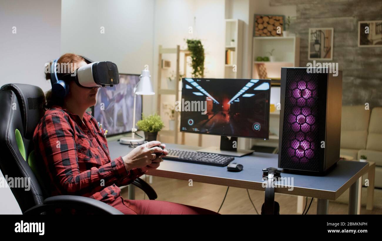 Gamer girl losing video game tournament while playing with VR headset ...