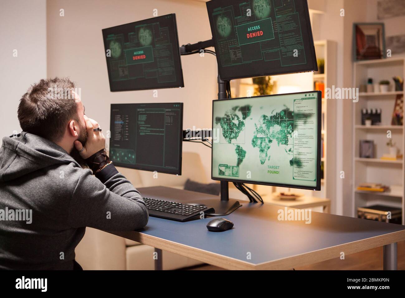Angry hacker covering his face because couldn't hack government main ...