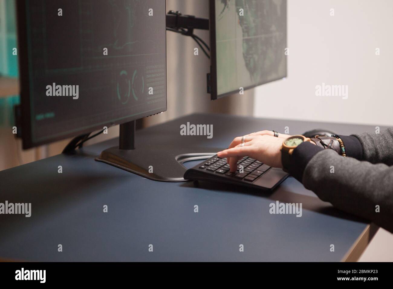 Close up of hacker hands writing a dangerous virus for cyberterrorism ...