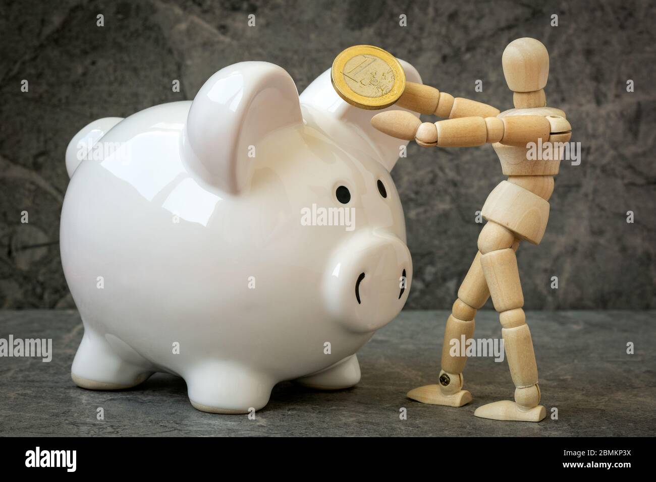 Dummy put coin to piggy bank, concept saving money for the future Stock ...