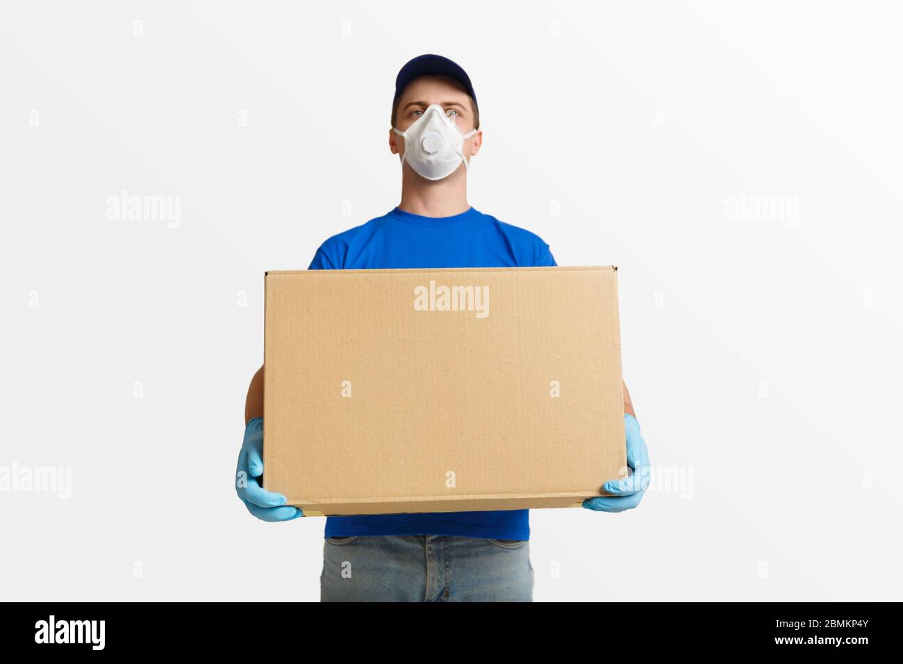 Delivery at home. Delivery man with parcel Stock Photo - Alamy