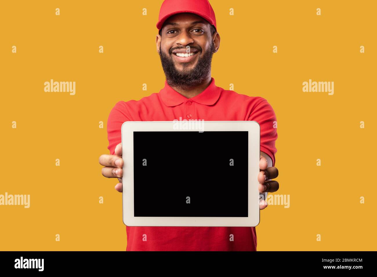 Courier Showing Tablet Screen Recommending Delivery Service Over Yellow ...