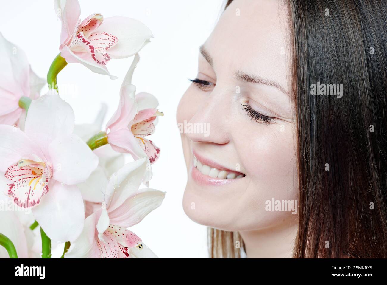 Beautiful Happy Woman With Orchid Flower Over White Background Stock