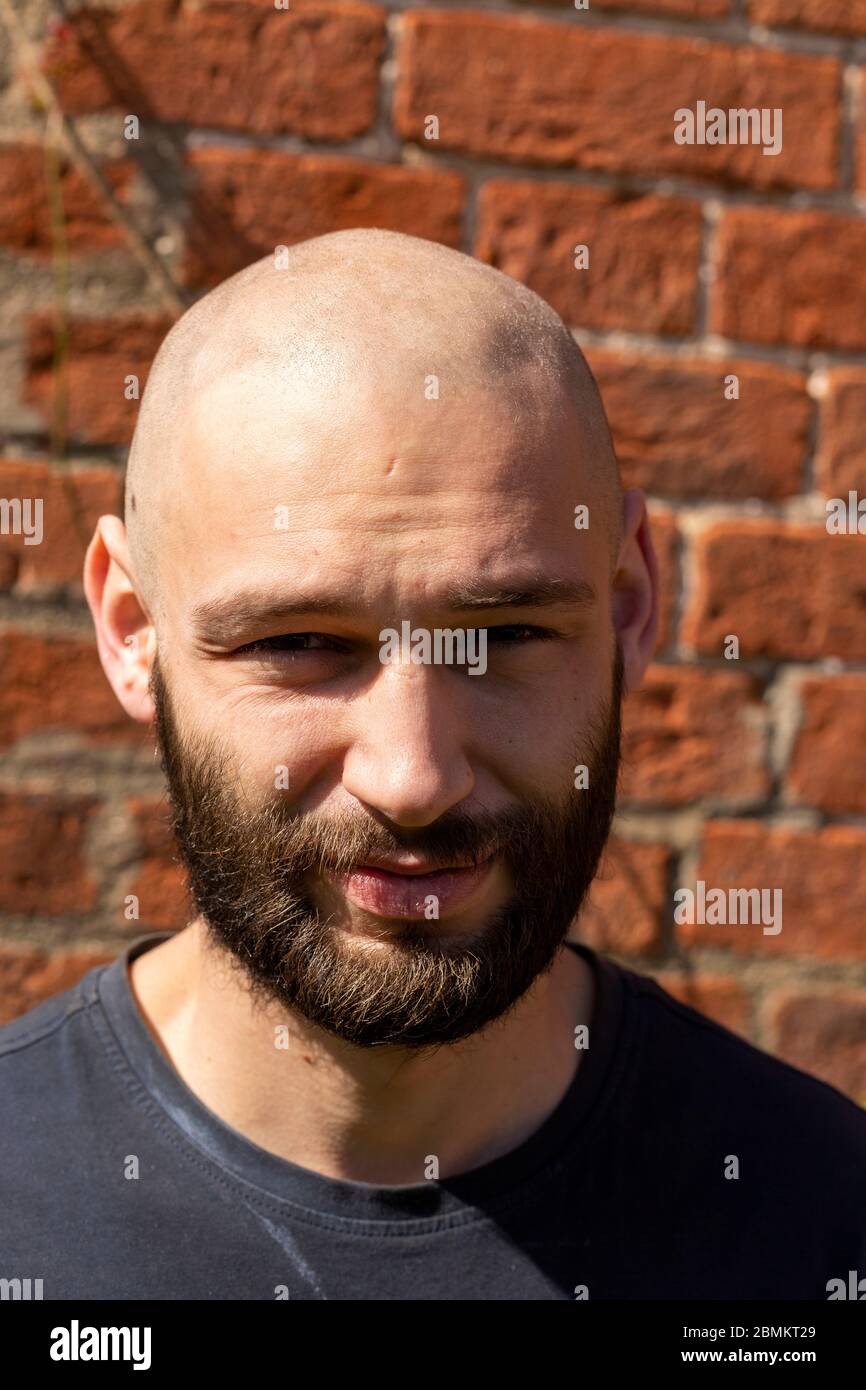 Young serious caucasian man face shaved hi-res stock photography and images - Alamy