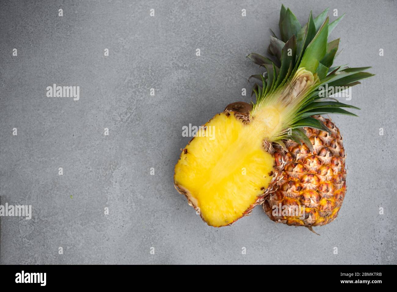 Ripe pineapple on grey background, isolated exotic fruit Stock Photo ...