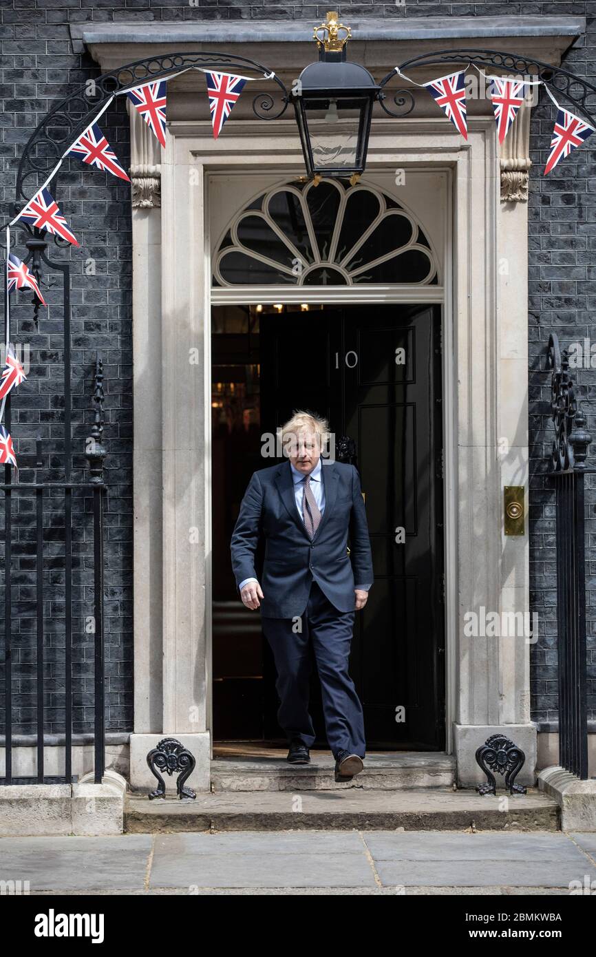 UK Prime Minister Boris Johnson steps onto the entrance of No.10 ...