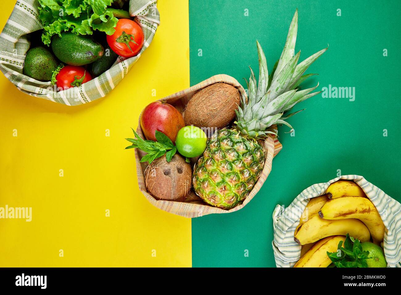 Flat lay of eco friendly grocery shopping cotton bags with organic ...