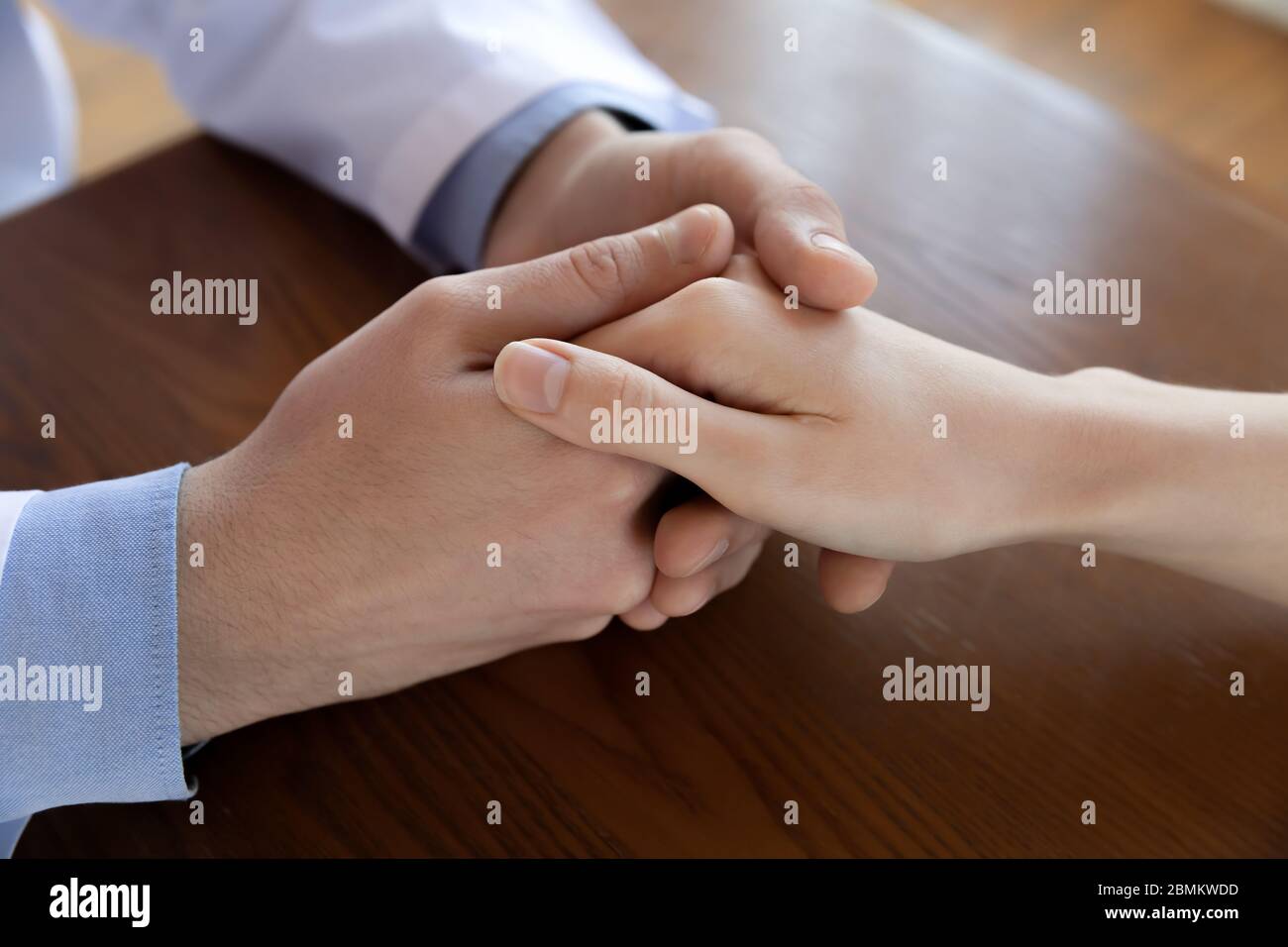 Close up of supportive doctor comfort female patient Stock Photo - Alamy
