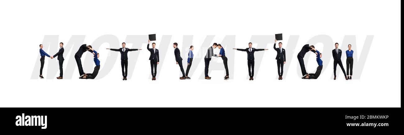 Group of people forming Motivation word at studio Stock Photo - Alamy