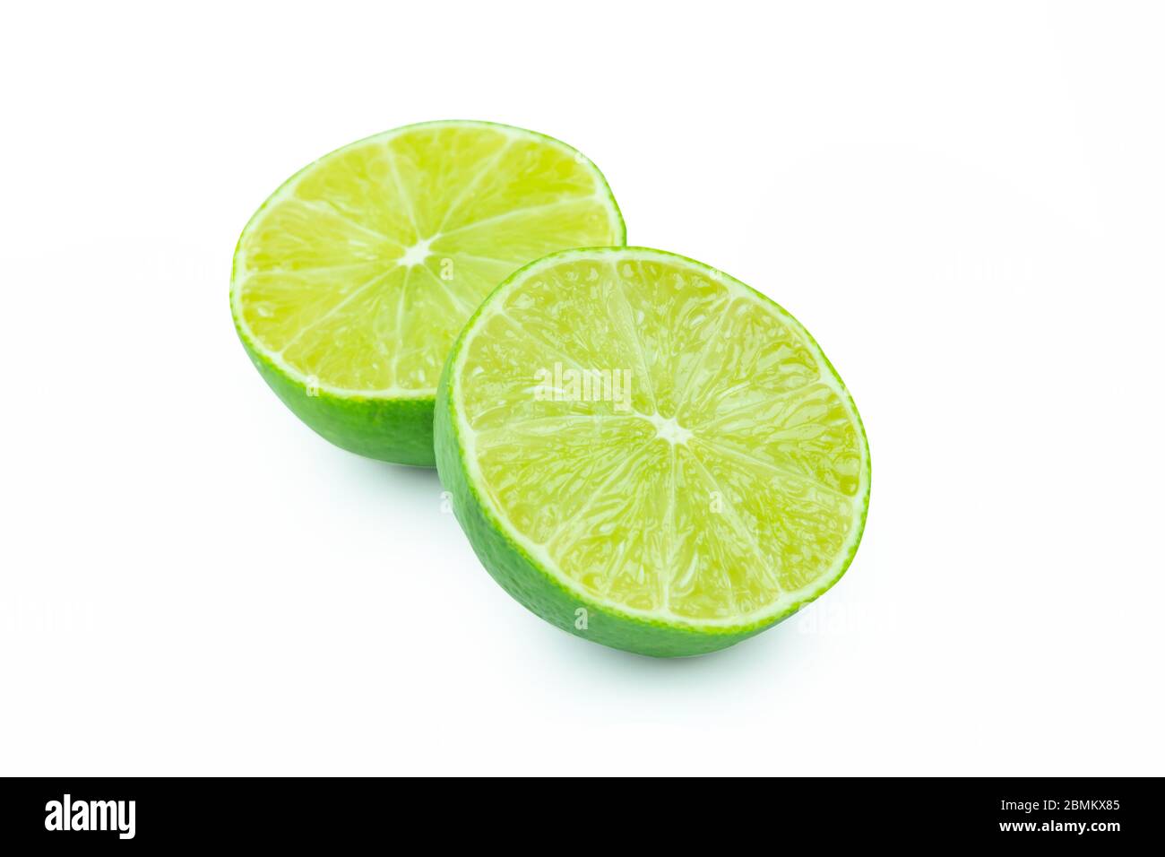 Lime with slices half isolated on white background. Green citrus fruit ...