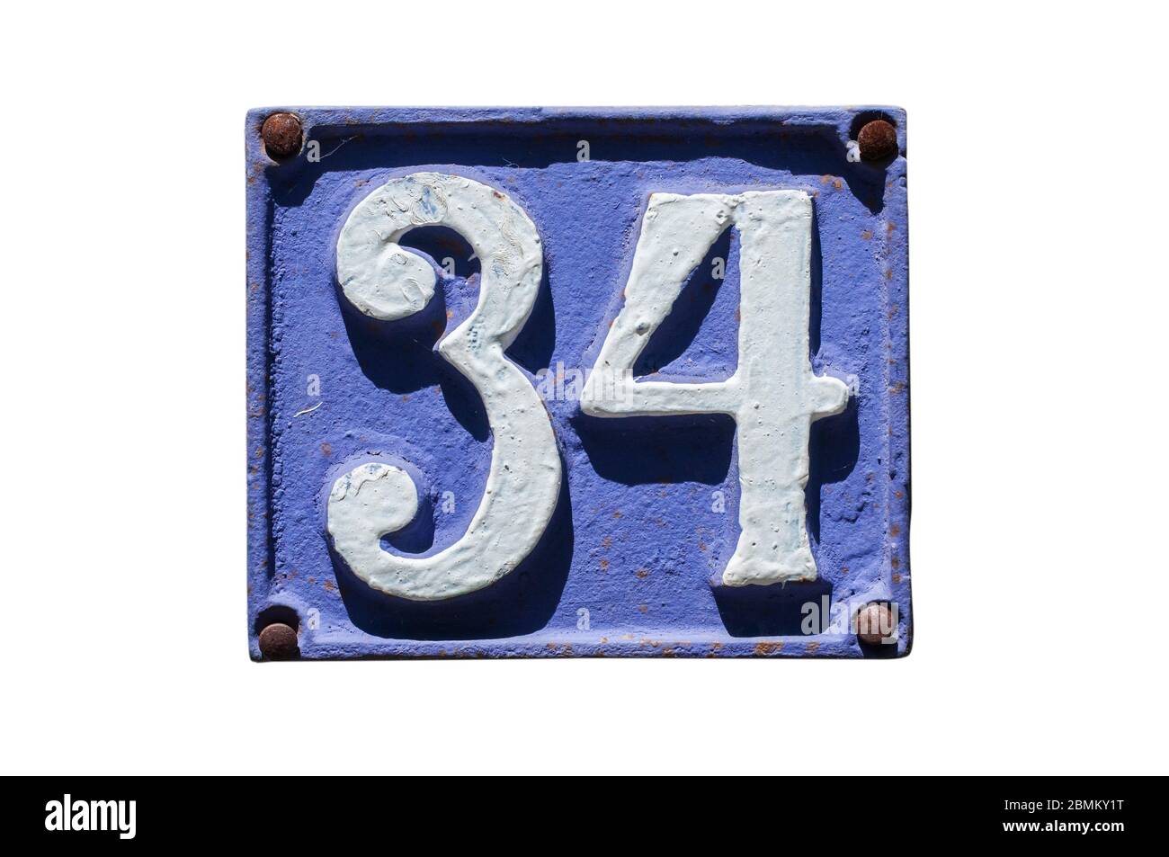 Old retro weathered cast iron plate with number 34 closeup isolated on ...
