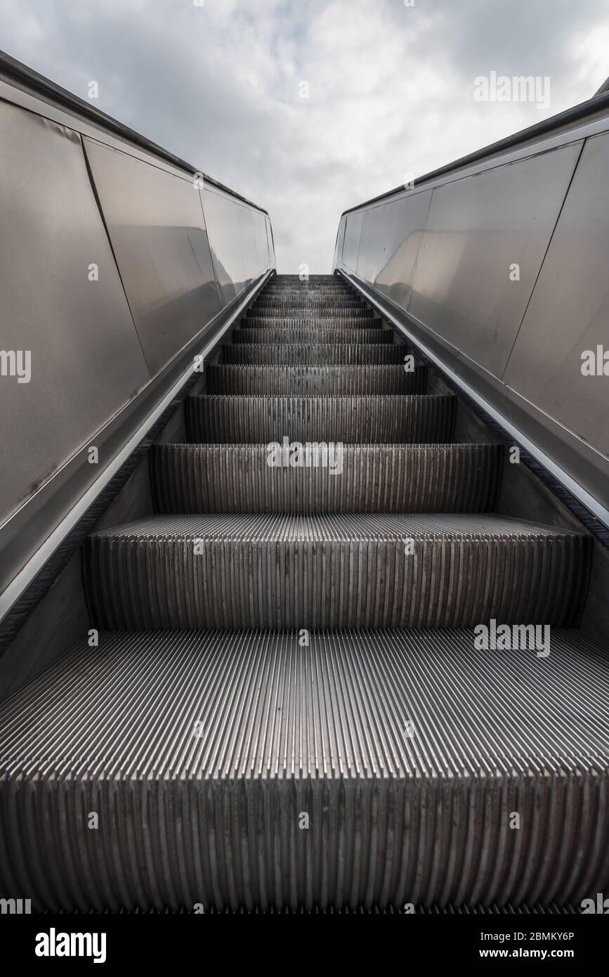 Modern moving steps escalator close hi-res stock photography and images ...