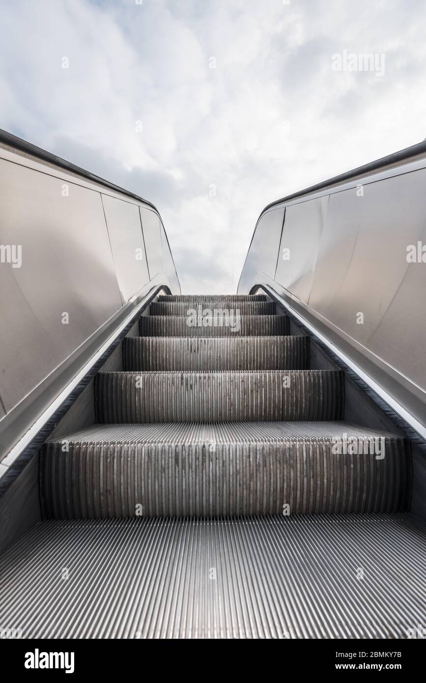 Modern moving steps escalator close hi-res stock photography and images ...