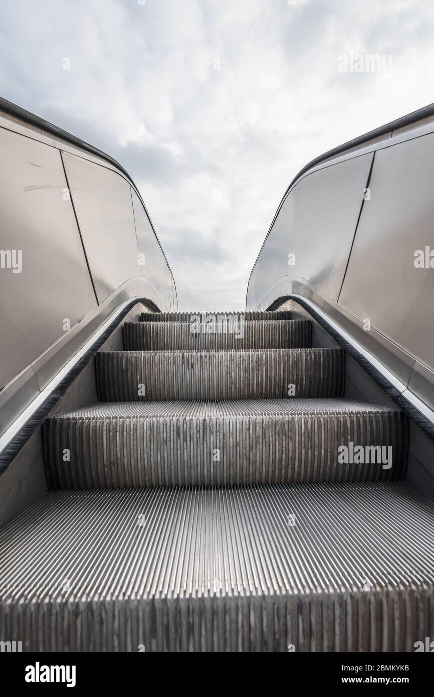 Modern moving steps escalator close hi-res stock photography and images ...
