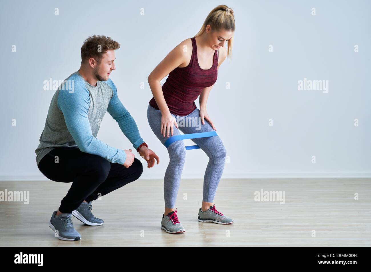 Adult woman training with her personal trainer Stock Photo - Alamy