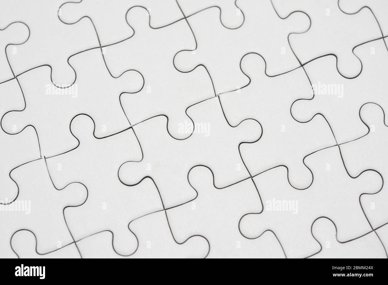White jigsaw puzzle pattern background Stock Photo - Alamy