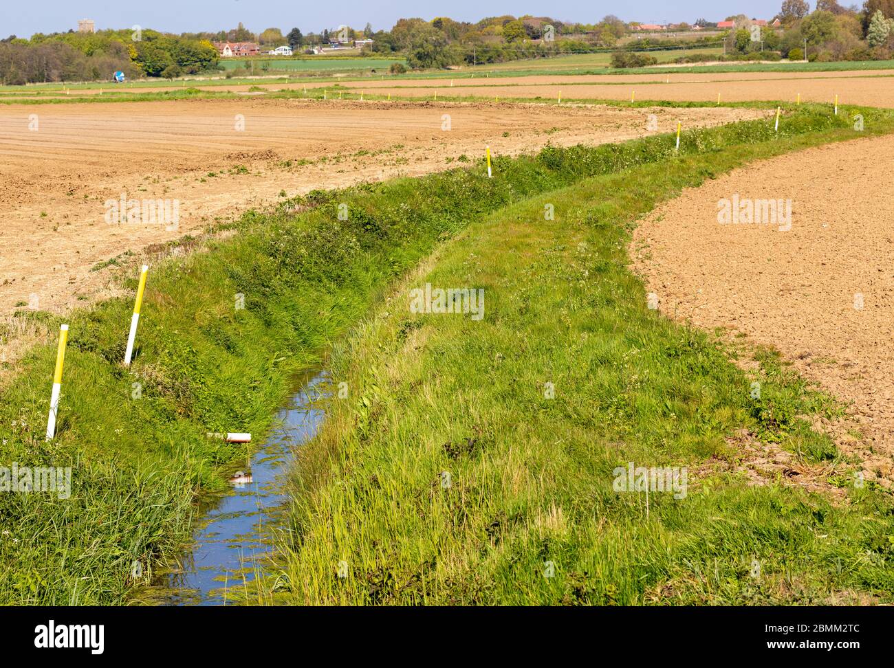 Water in drainage ditch channel through arable farmland, Hollesley ...