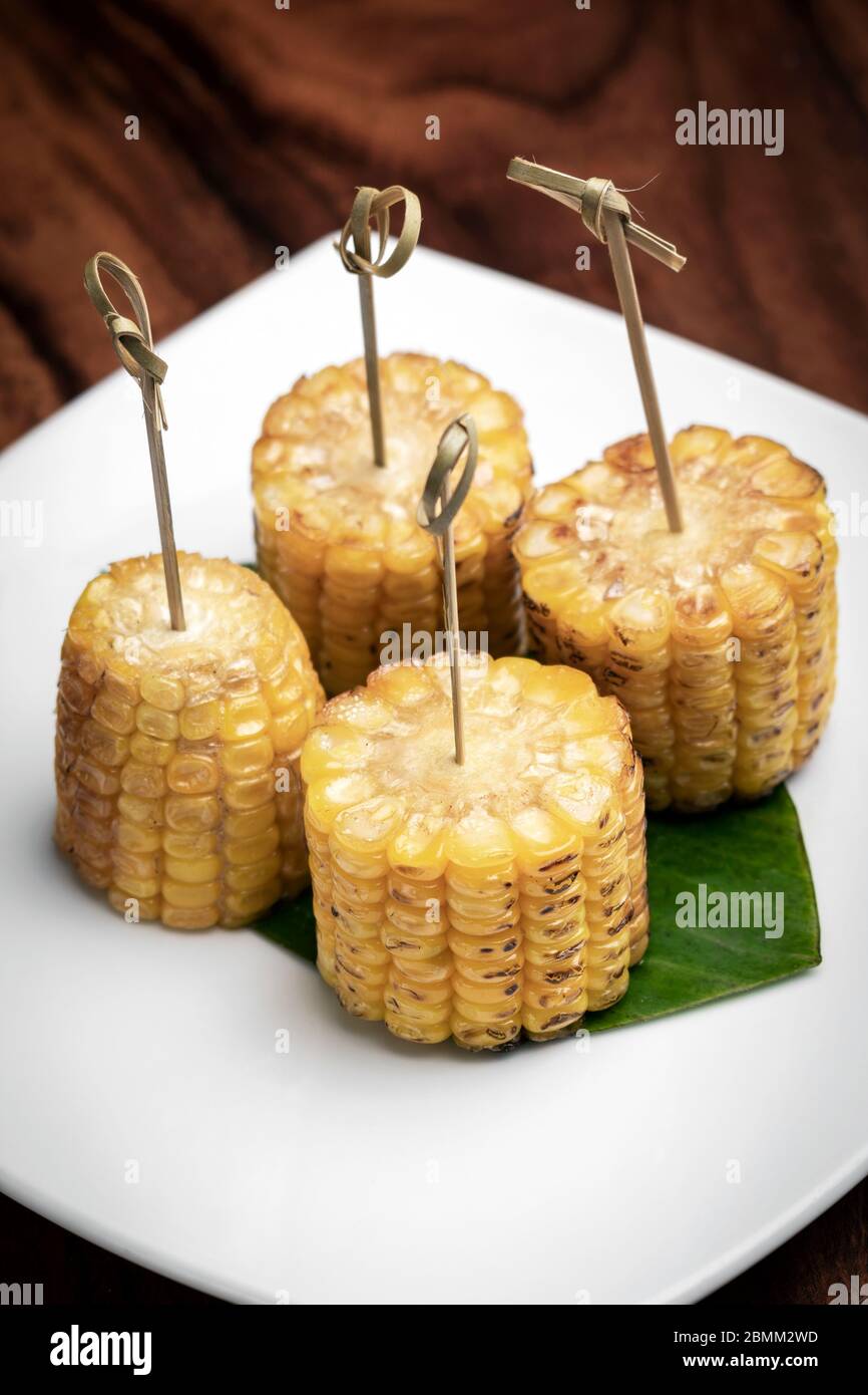sweet corn on the cob vegetarian tapas snack food Stock Photo - Alamy