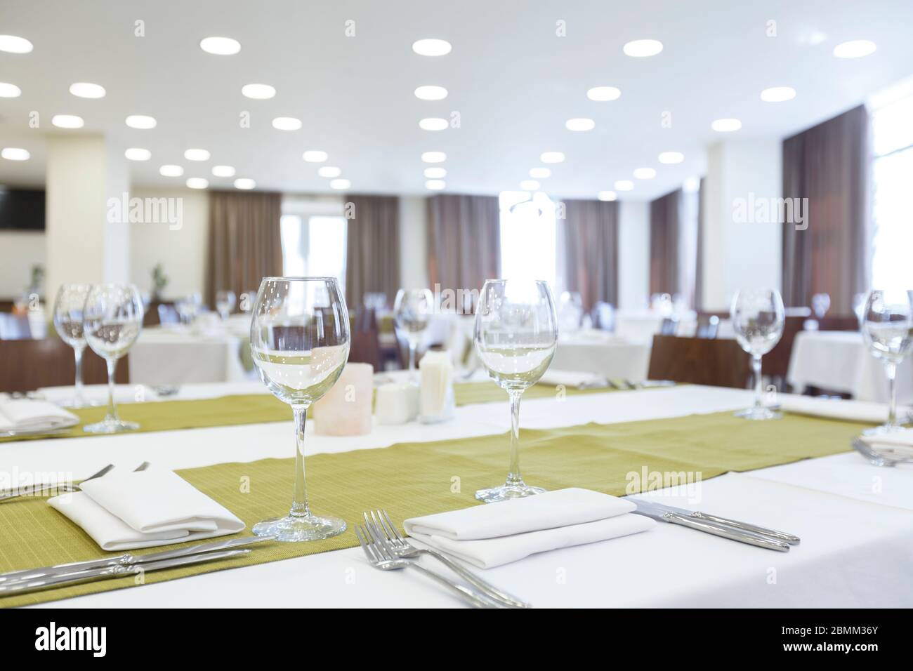 Empty stylish table in restaurant with glasses Stock Photo - Alamy