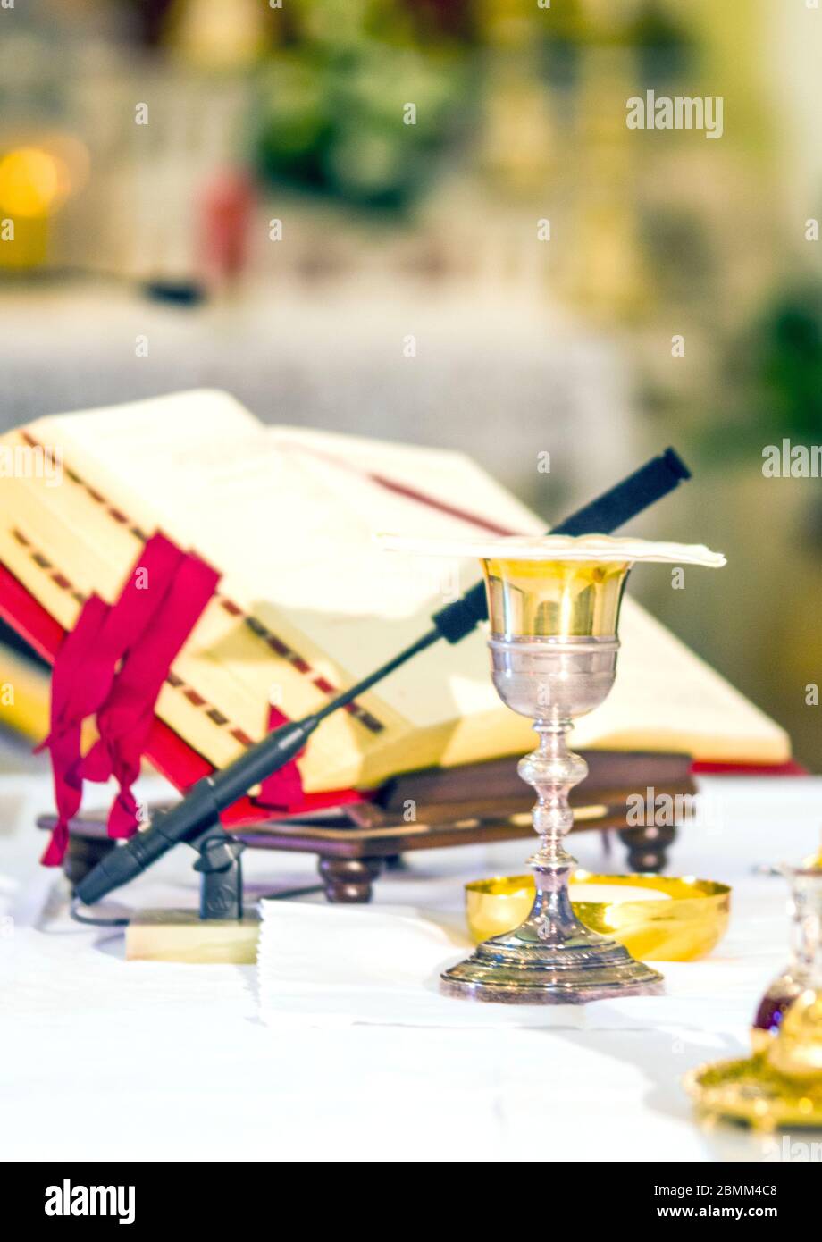 altar with host that becomes the body of jesus christ and chalice for ...