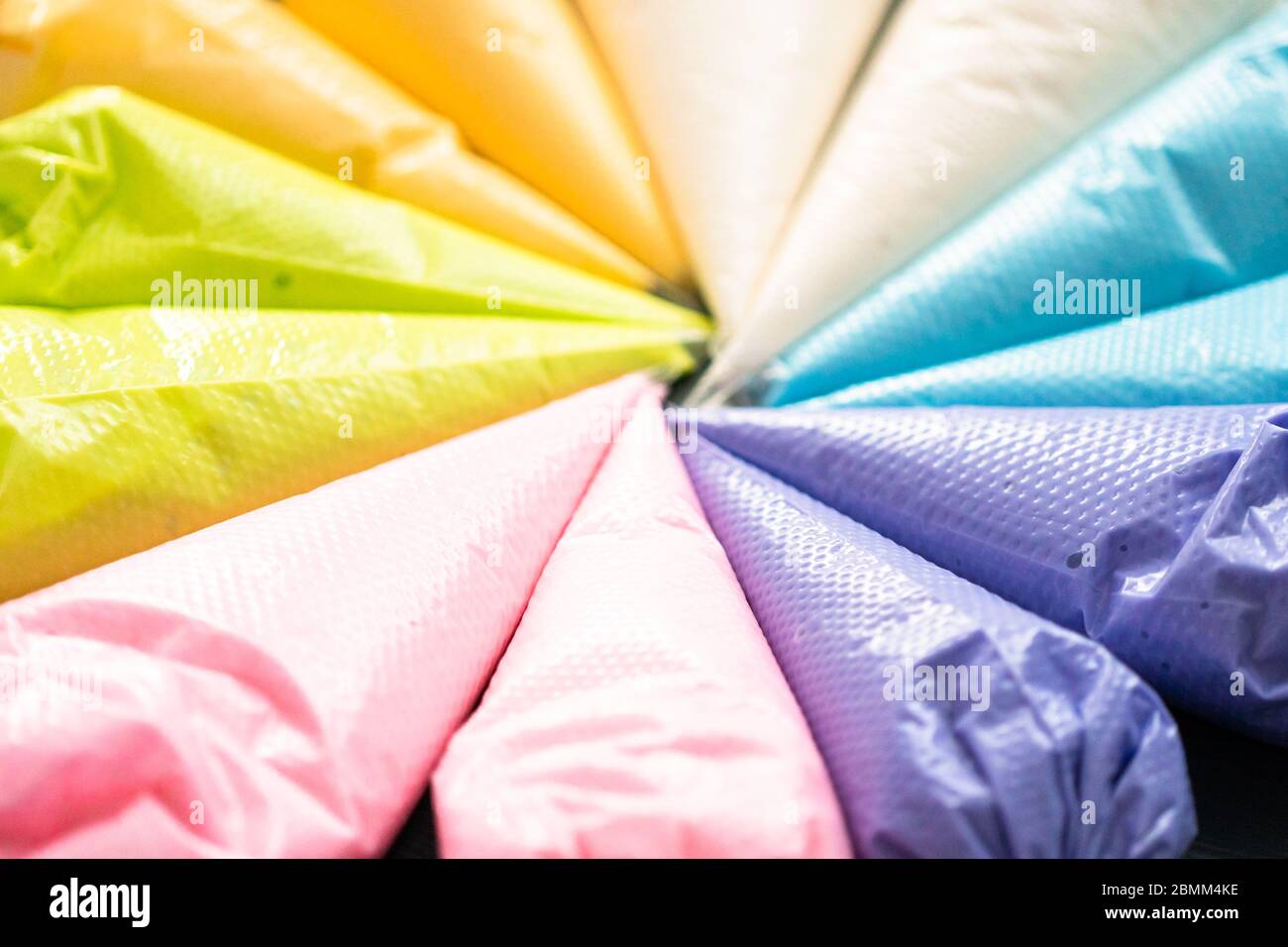 Variety of colors of royal icing in plastic piping bags Stock Photo - Alamy