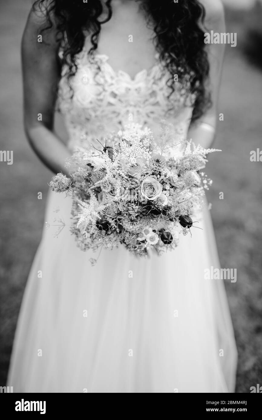 Bride holding flower bouquet close up Stock Photo - Alamy