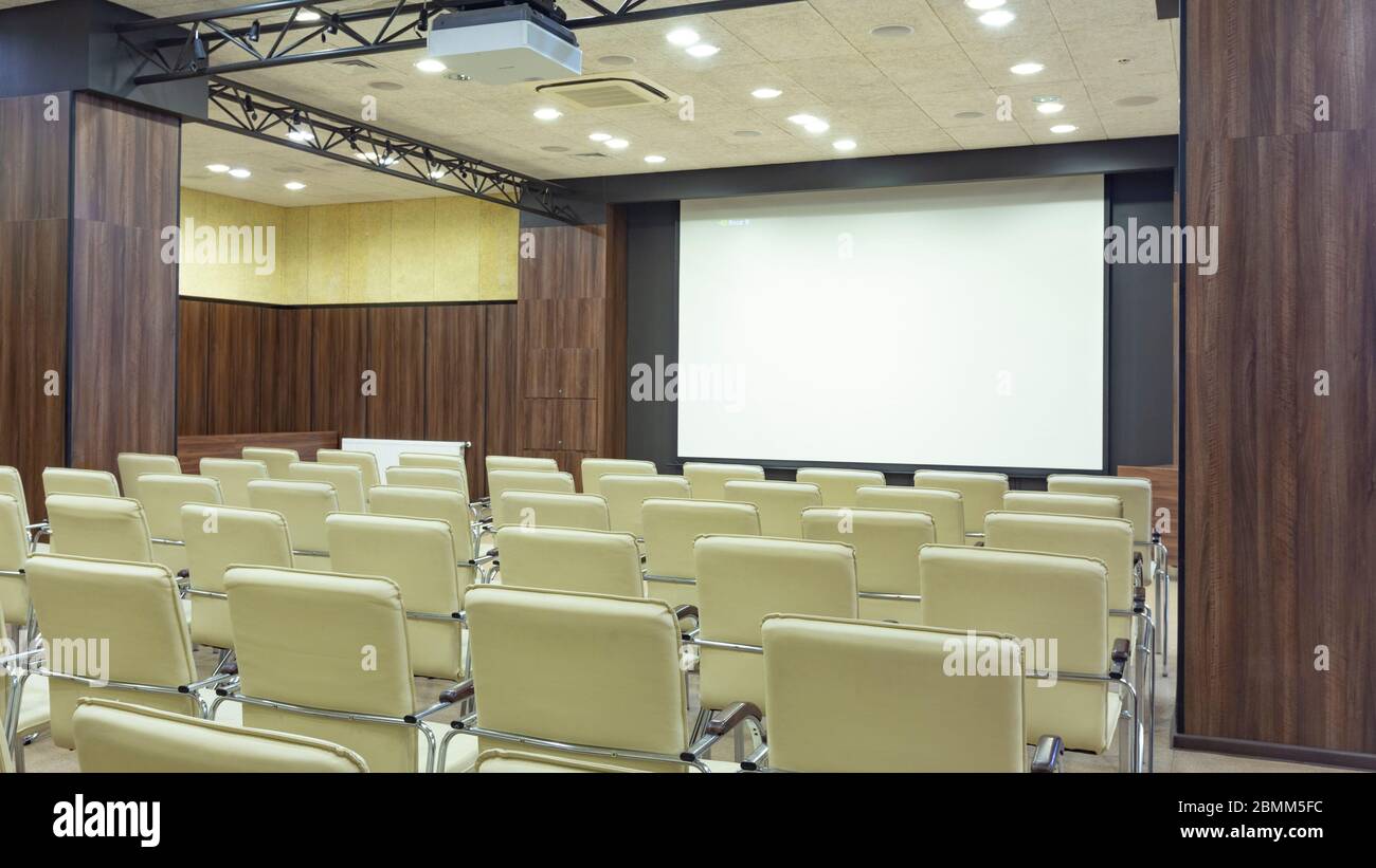Auditorium with chairs and blank screen, panorama Stock Photo - Alamy