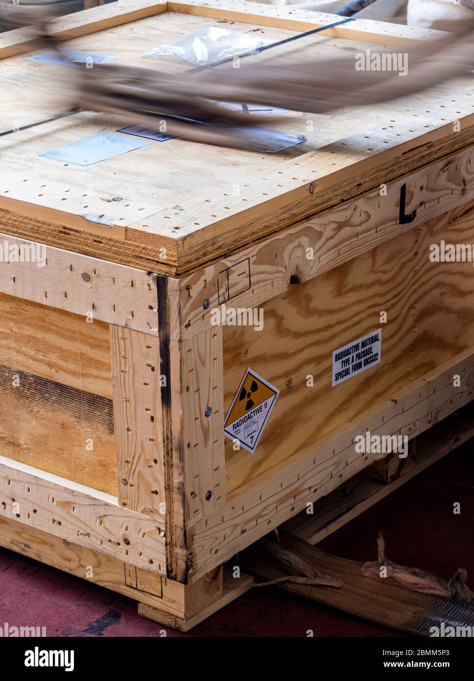 The radioactive material label beside the transportation wooden box ...