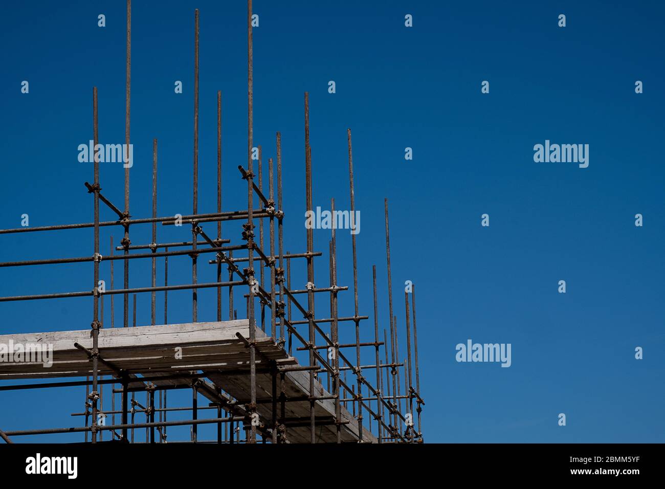 scaffolding building construction site against blue sky Stock Photo - Alamy
