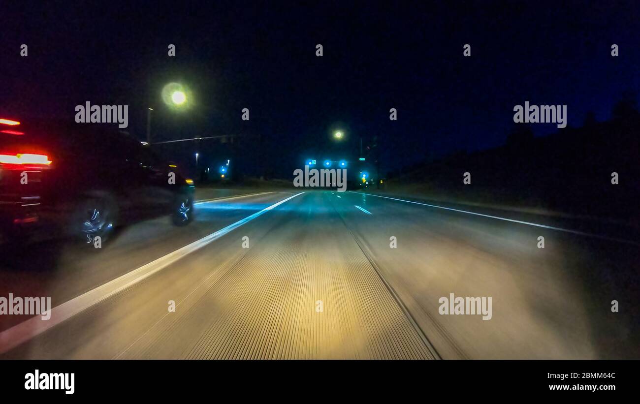 Driving on typical paved roads at night in suburban America Stock Photo ...