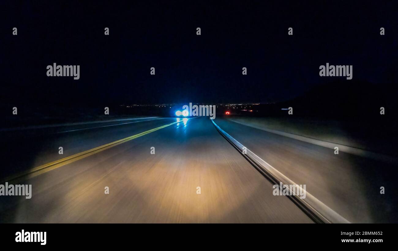 Driving on typical paved roads at night in suburban America Stock Photo ...