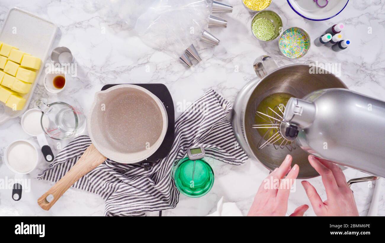 Caramelizing sugar in a saucepan for Italian buttercream frosting Stock ...