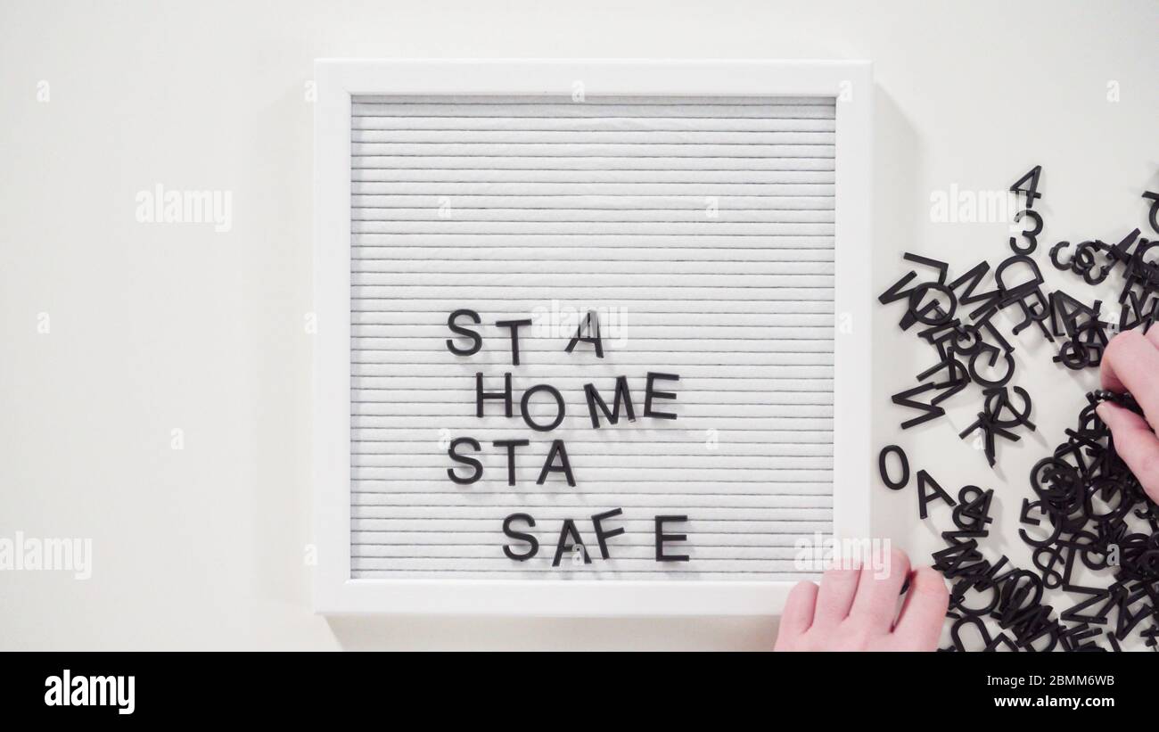Flat lay. STAY HOME and STAY SAFE sign on a white message board Stock ...