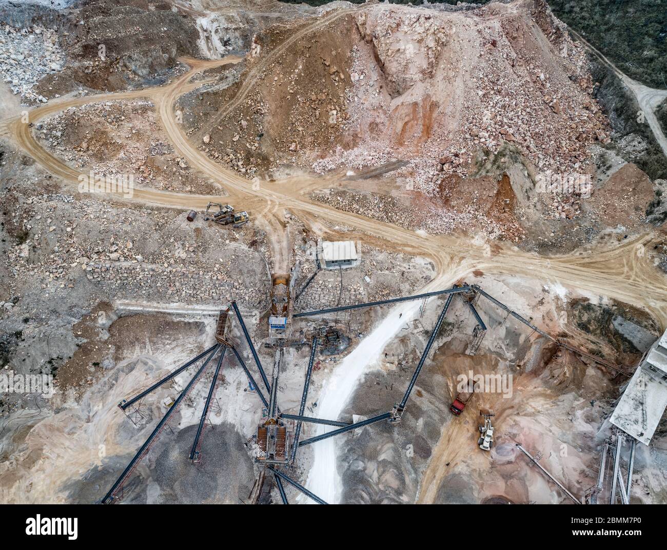 Aerial view of crushed stone quarry machine in a construction material ...