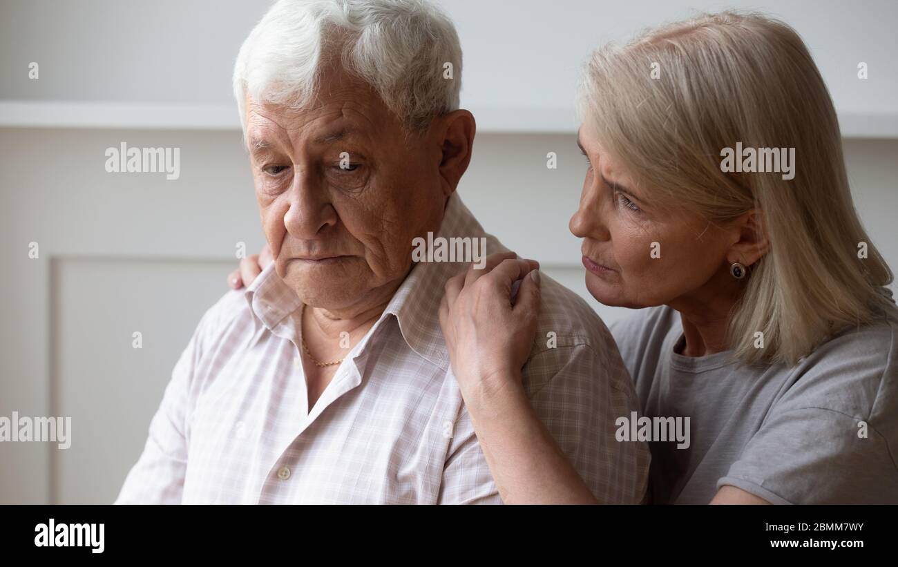 Caring senior wife hug comfort upset elderly husband Stock Photo - Alamy