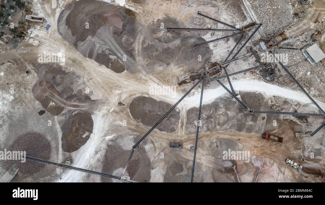 Aerial view of crushed stone quarry machine in a construction material ...