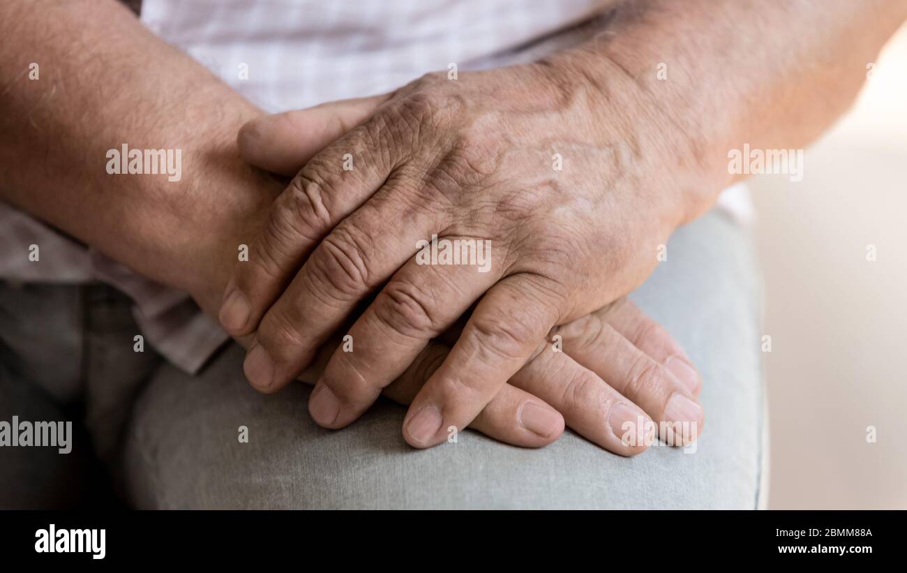 Senior man hold hands feeling lonely in retirement house Stock Photo ...