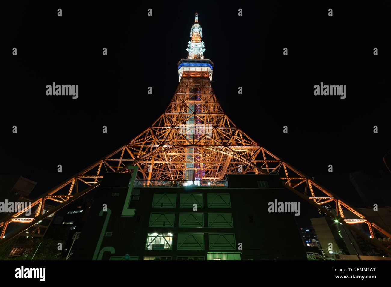 Tokyo, Japan - August 30, 2016: Tokyo Tower illuminated at night. Tokyo communications and ...