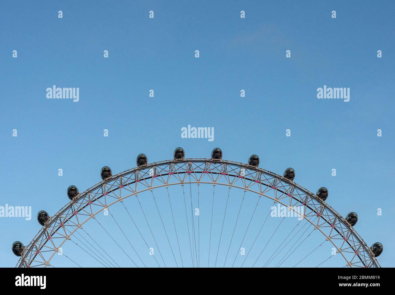 London Eye, isolated, blue sky, dusk, symmetrical, upper part, against ...